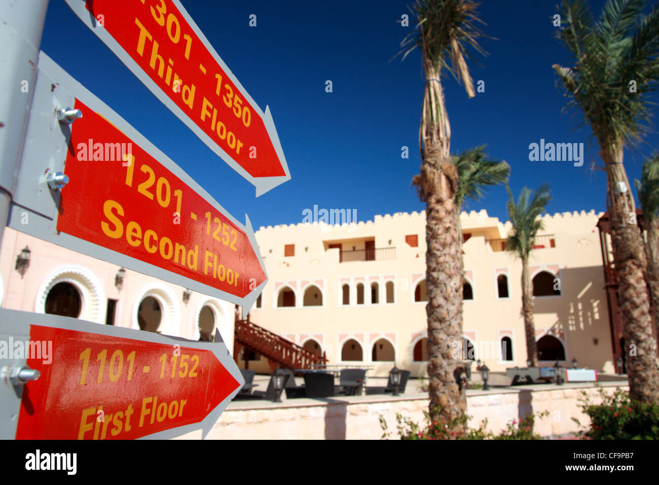 Red signs in a tropical hotel Stock Photo - Alamy