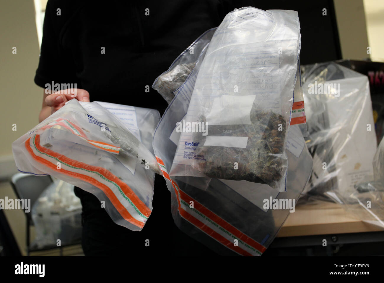 A police officer pictured with a haul of drugs at a Police station in ...