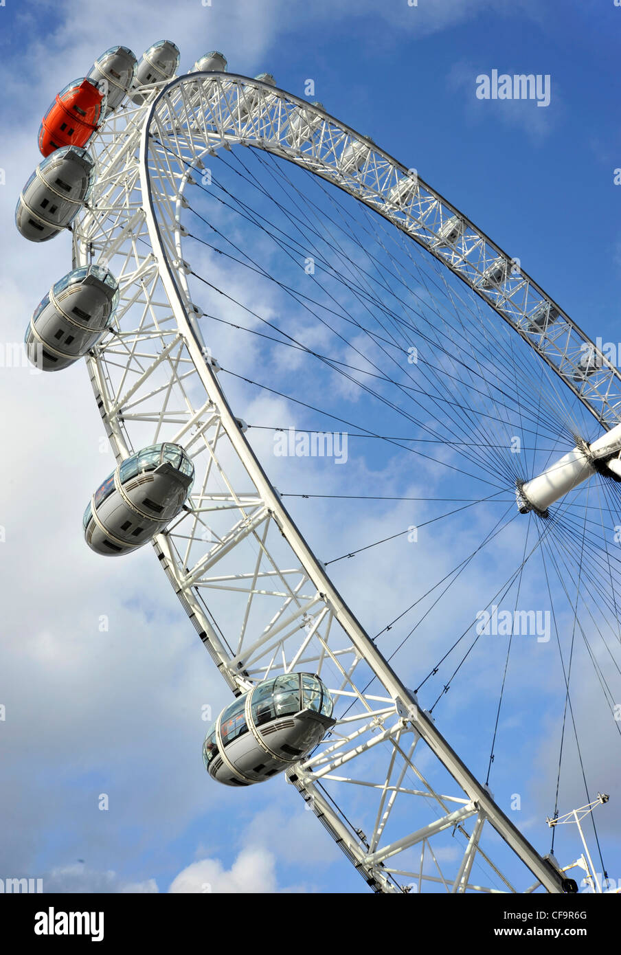 The London Eye against a blue sky with one red pod Stock Photo - Alamy