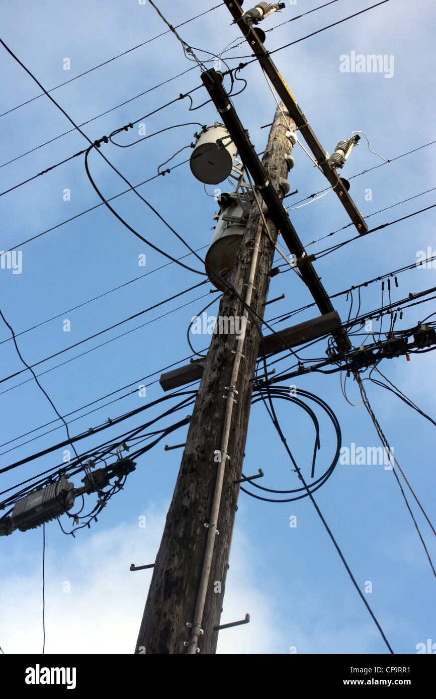 Wires and cables on a telegraph pole with blue sky background Stock ...