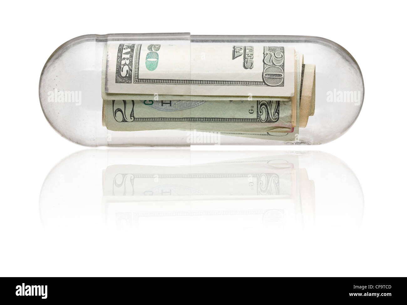 Dollar bills in medicine capsule - healthcare costs concept Stock Photo ...