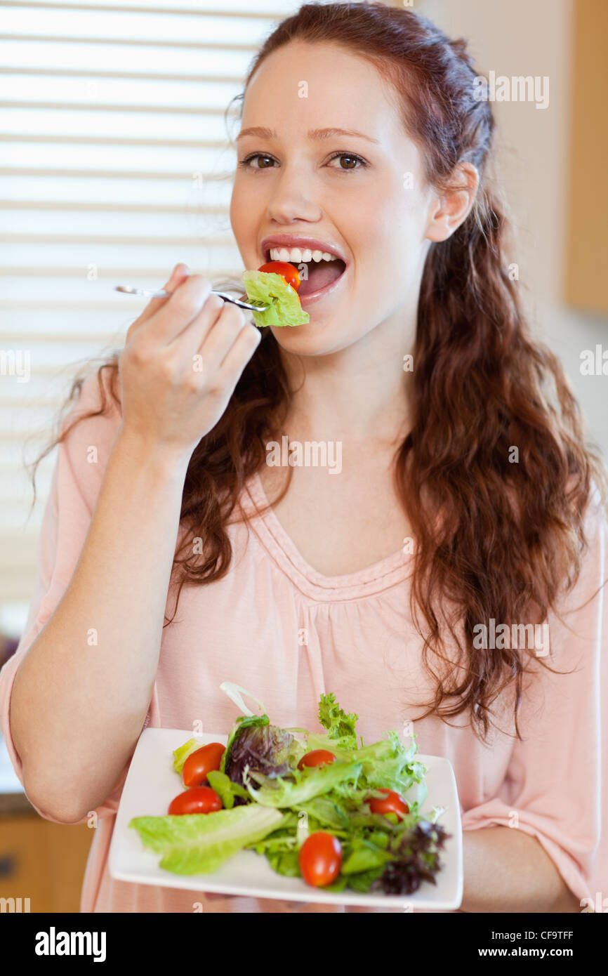 Girl having salad Stock Photo - Alamy