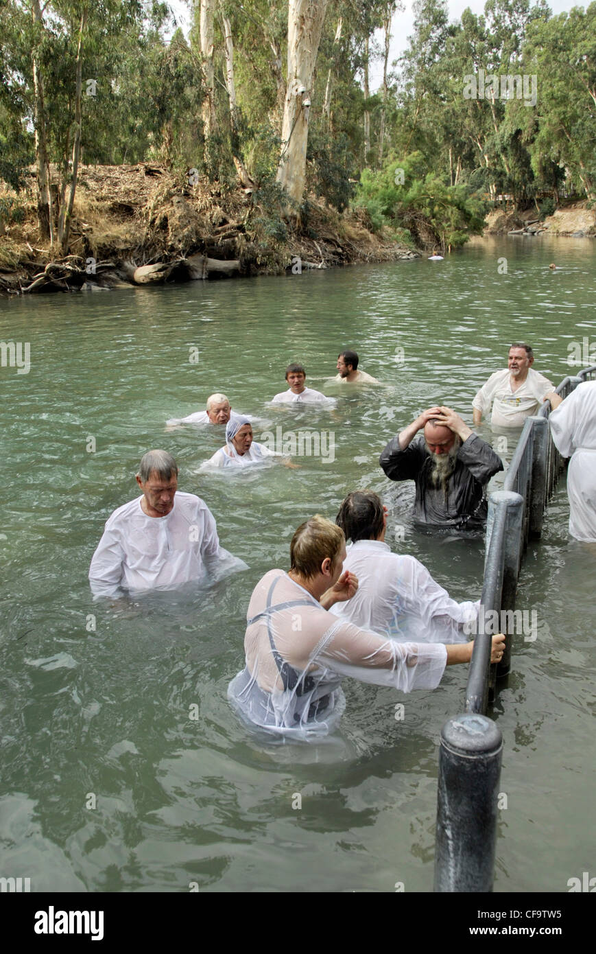 Russian Orthodox Pilgrims immersing themselves in the River Jordan at ...