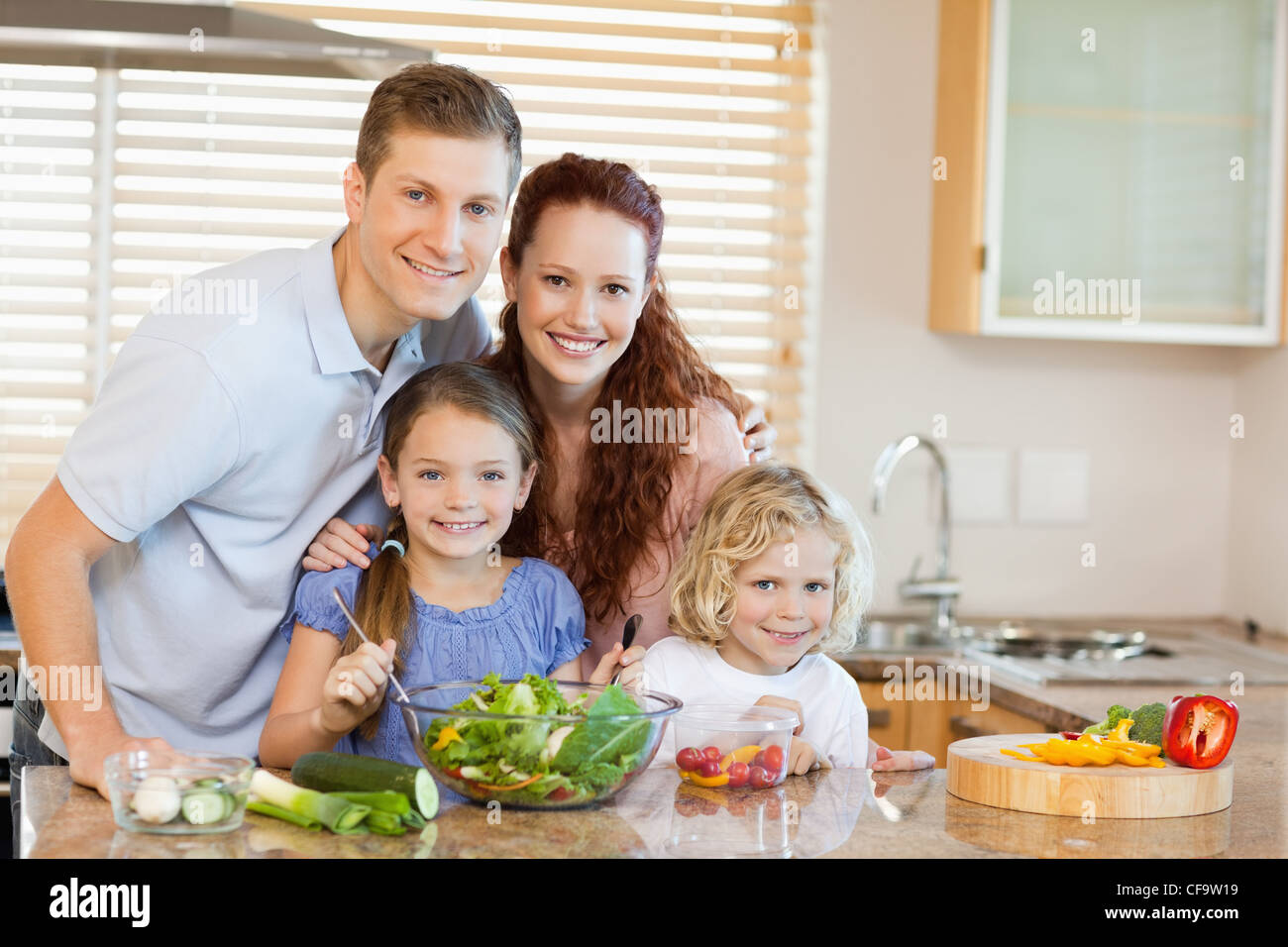 Family in the kitchen Stock Photo - Alamy