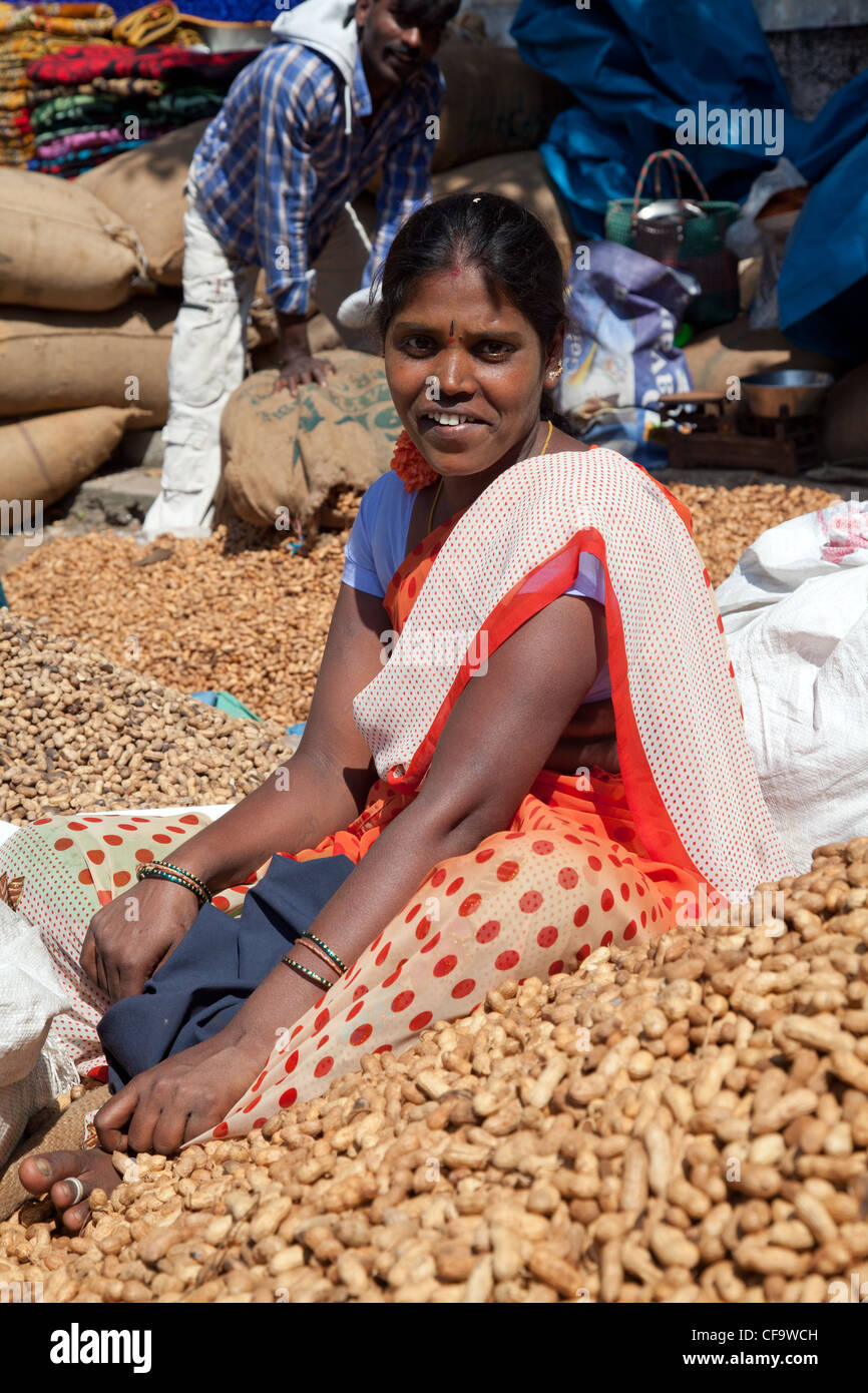 Vendor selling peanuts in market Stock Photo - Alamy