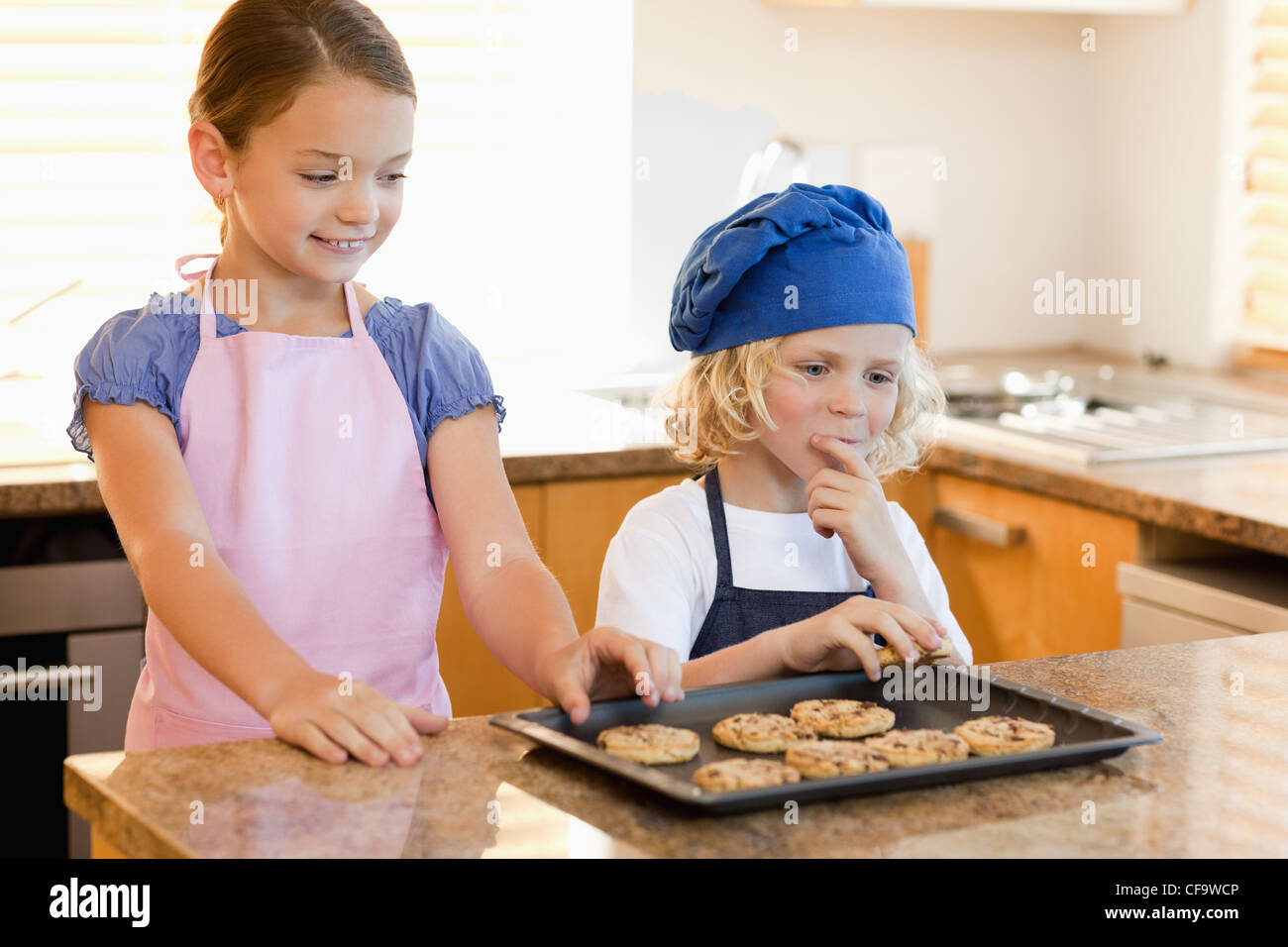 Boy stealing food hi-res stock photography and images - Alamy