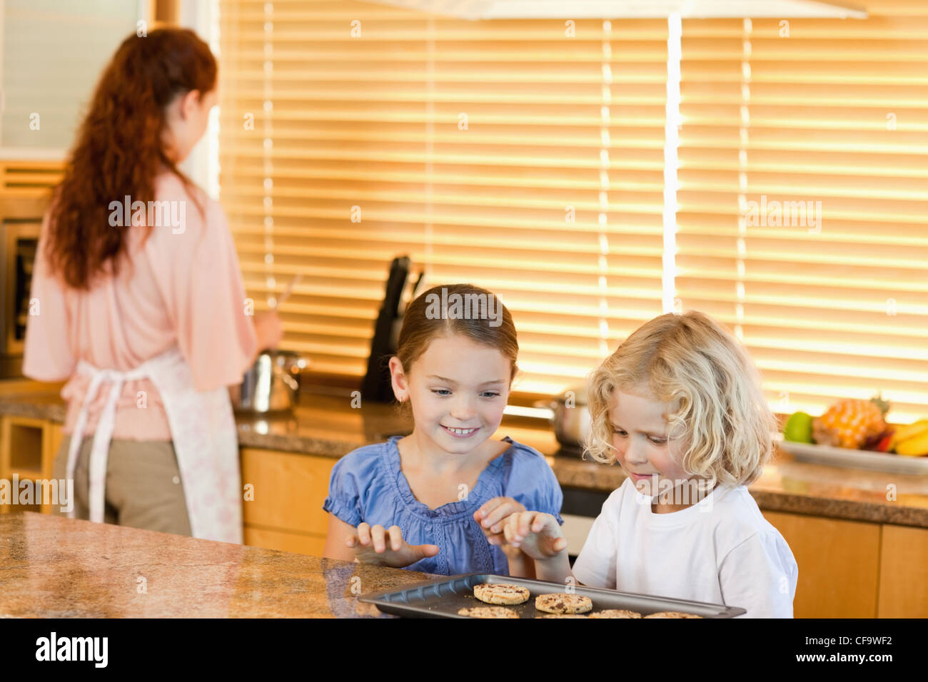 Child stealing biscuits hi-res stock photography and images - Alamy