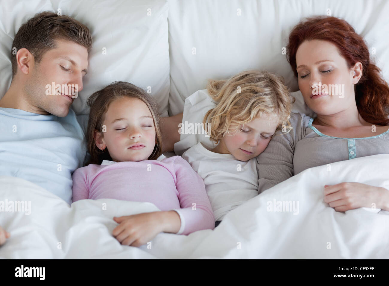 Family taking a rest together Stock Photo - Alamy