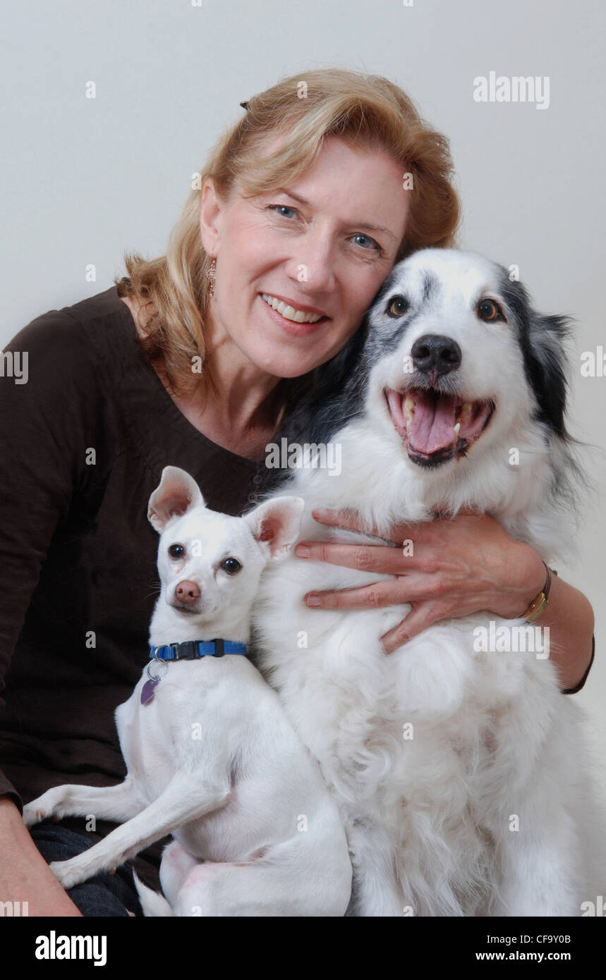 Woman two dogs sit hi-res stock photography and images - Alamy