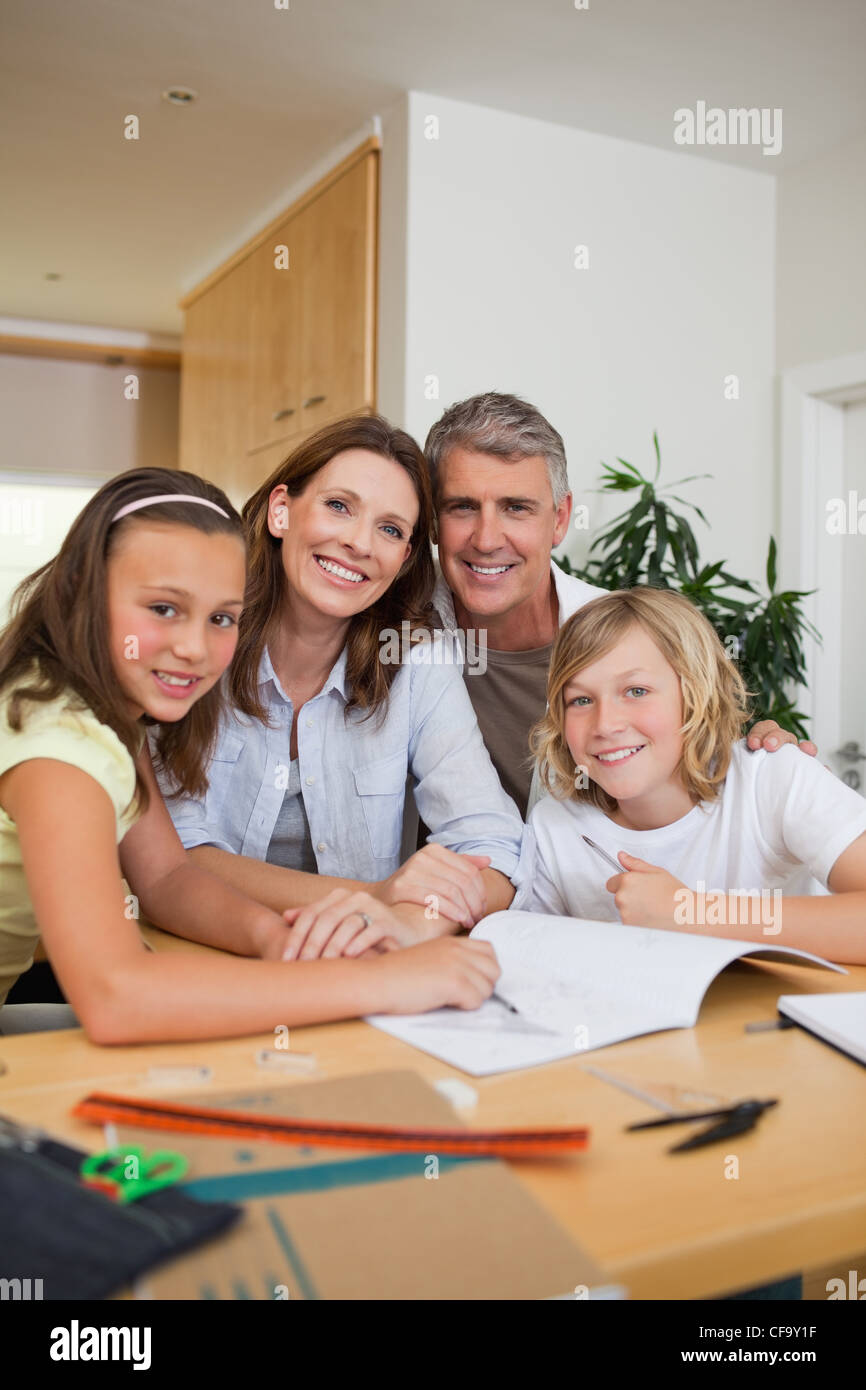 Family doing homework together Stock Photo - Alamy