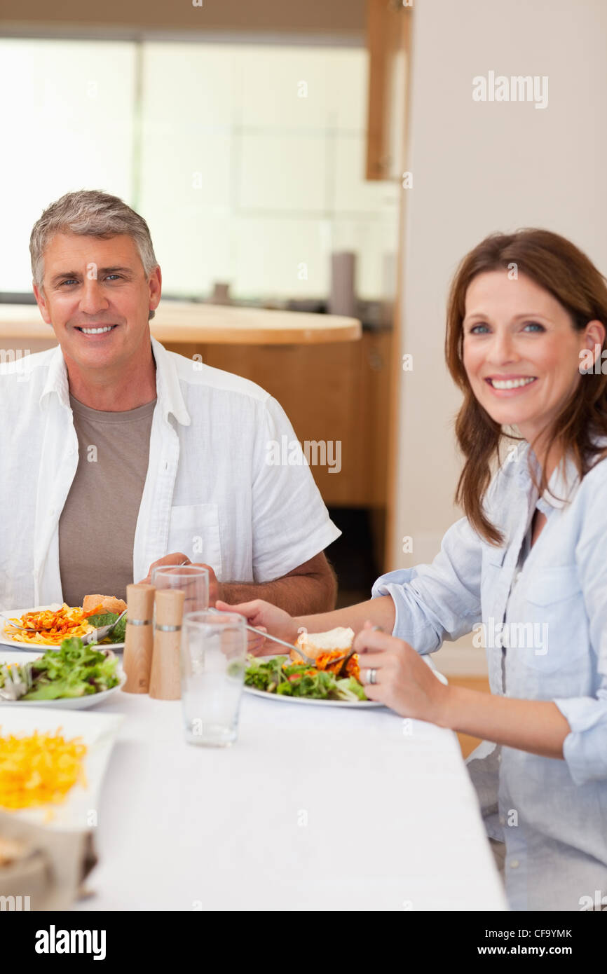 Happy couple eating dinner Stock Photo - Alamy