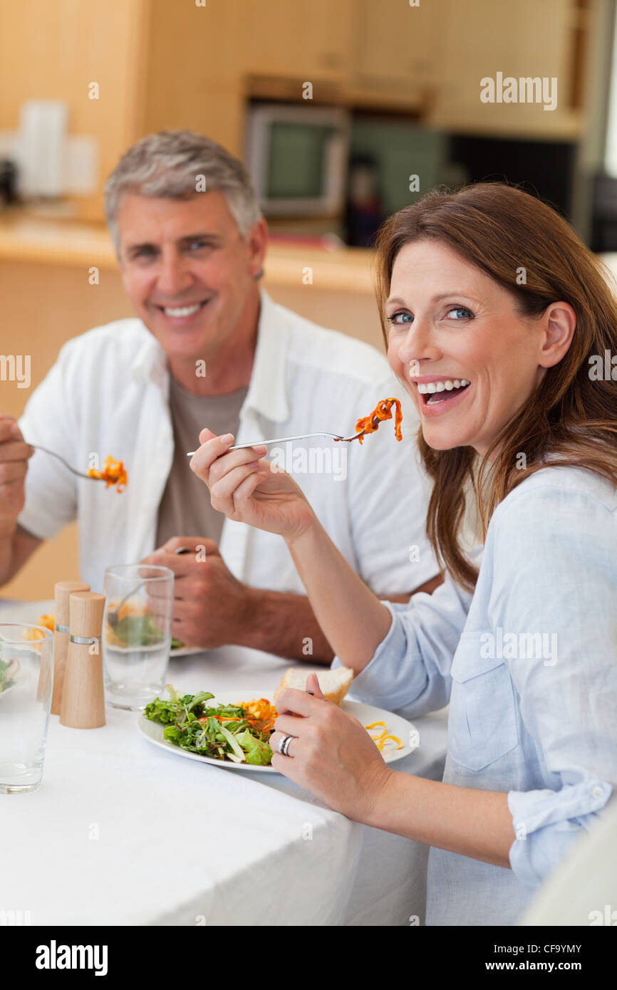 Happy couple eating dinner together Stock Photo - Alamy