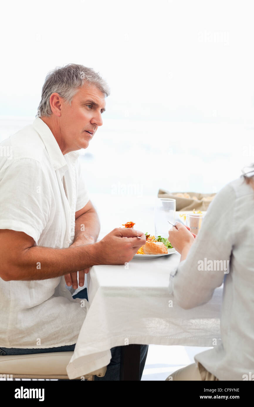 Side view of man having dinner Stock Photo - Alamy