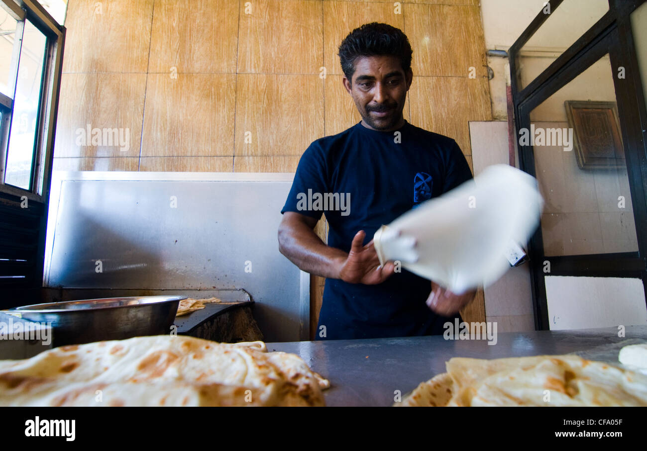 Making the Roti bread in a small hole in the wall restaurant in Kandy ...