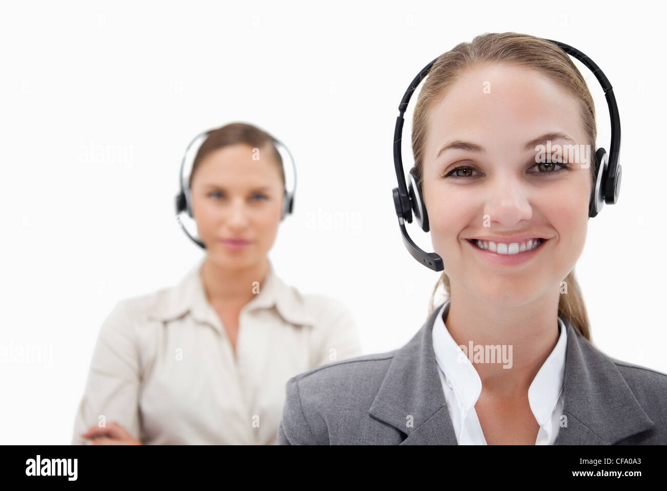 Smiling operators with headsets Stock Photo - Alamy
