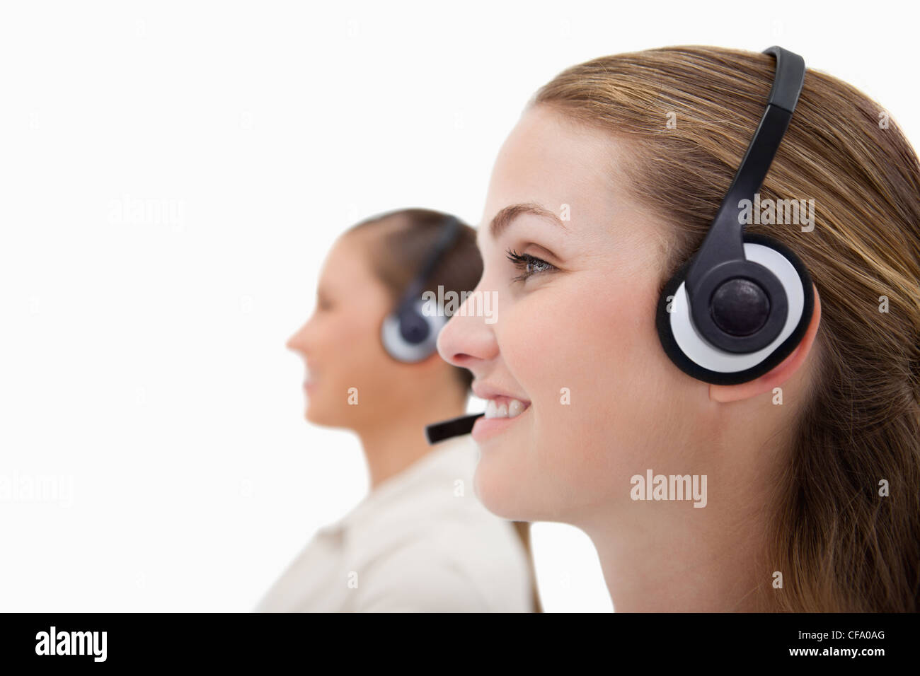Side view of operators using headsets Stock Photo - Alamy