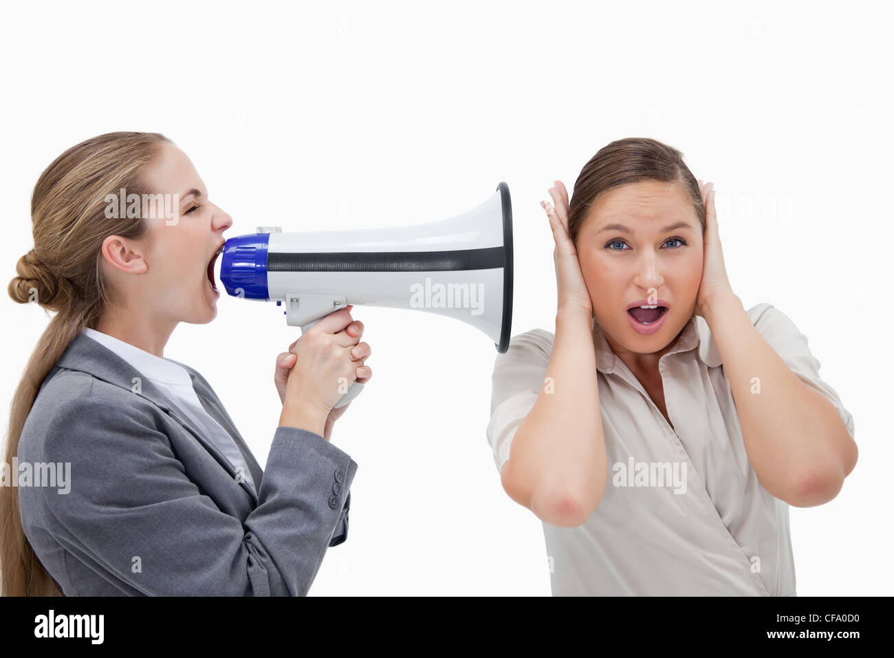 Businesswoman yelling at her coworker through a megaphone Stock Photo ...