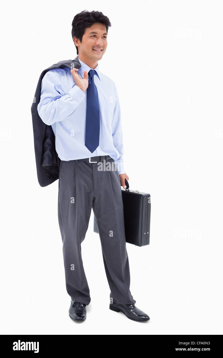 Portrait of a smiling businessman holding a briefcase and his jacket ...