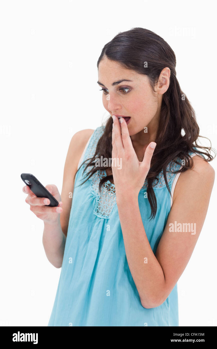 Portrait of a surprised woman reading a text message Stock Photo - Alamy