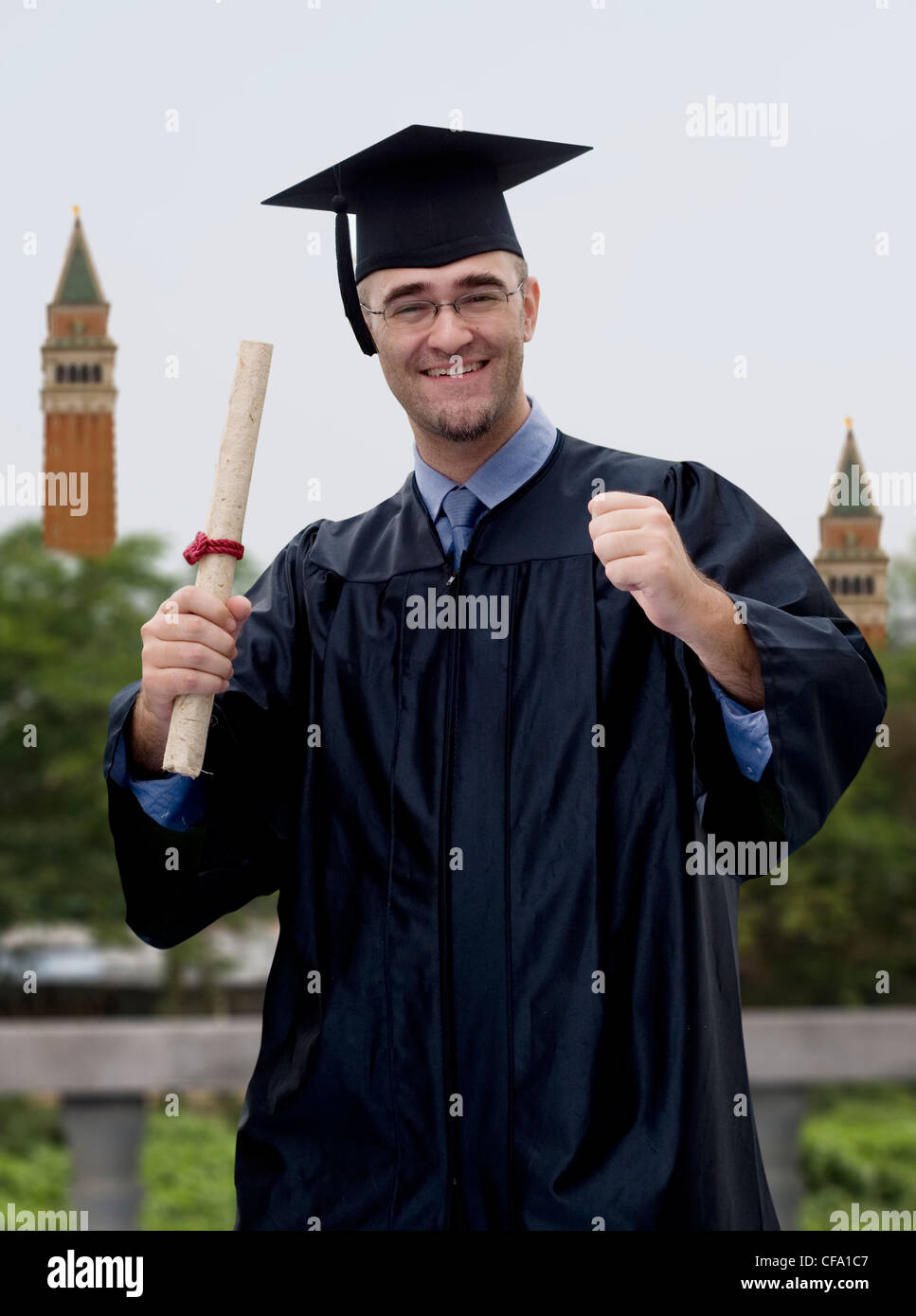 Young man with graduation cap and gown and diploma Stock Photo - Alamy