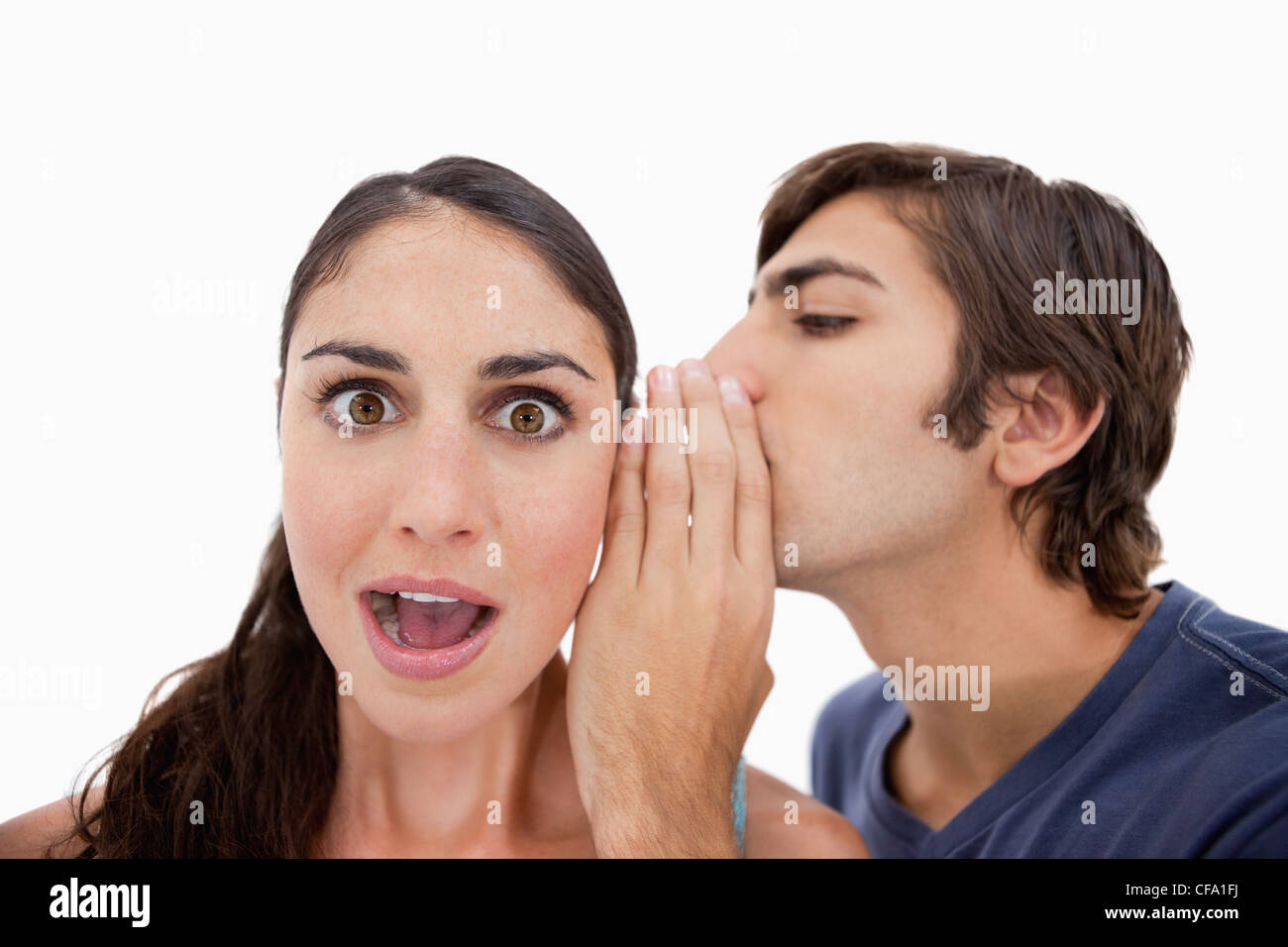 Young man woman whispering something hi-res stock photography and ...
