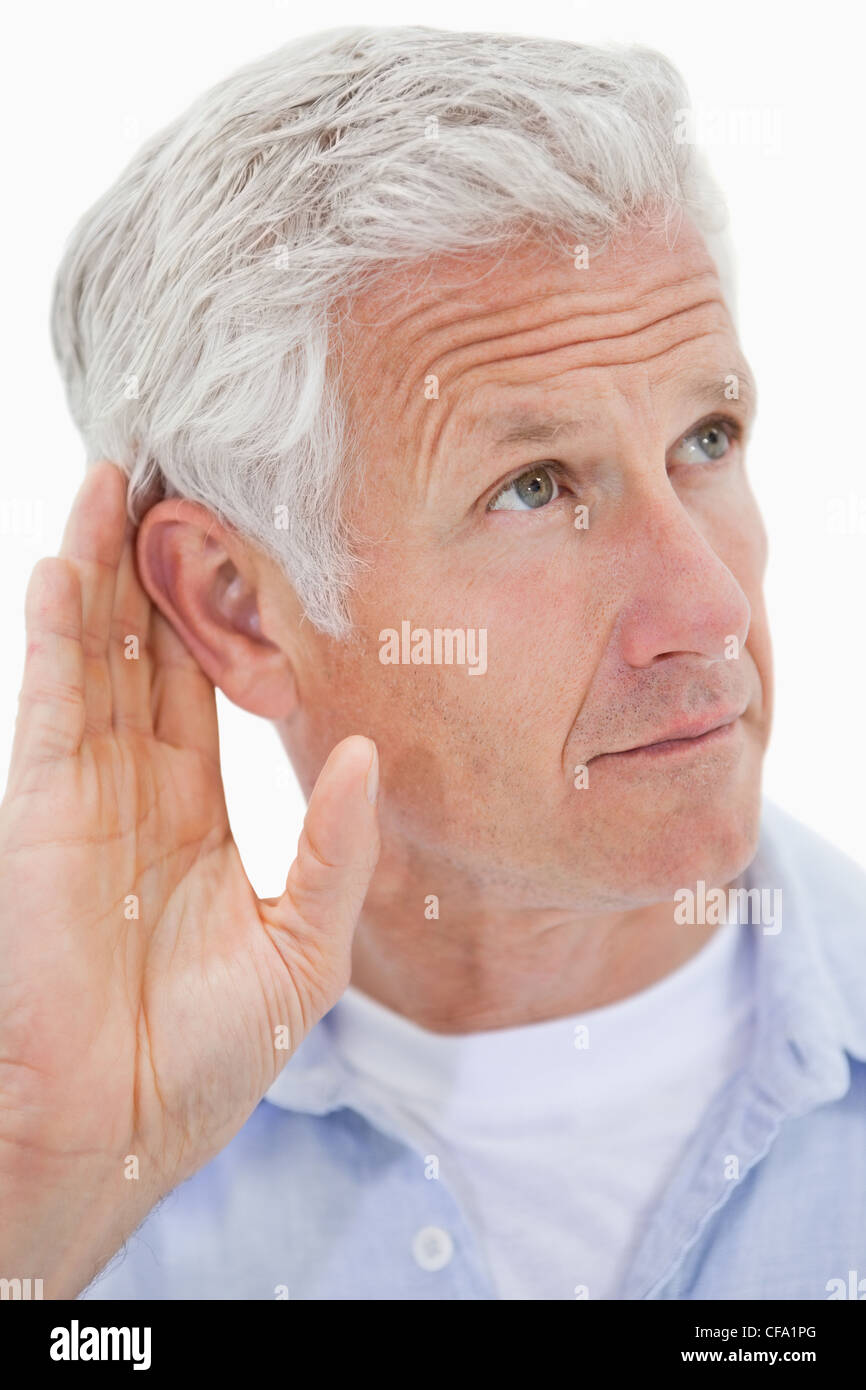 Portrait of a mature man giving his ear Stock Photo - Alamy