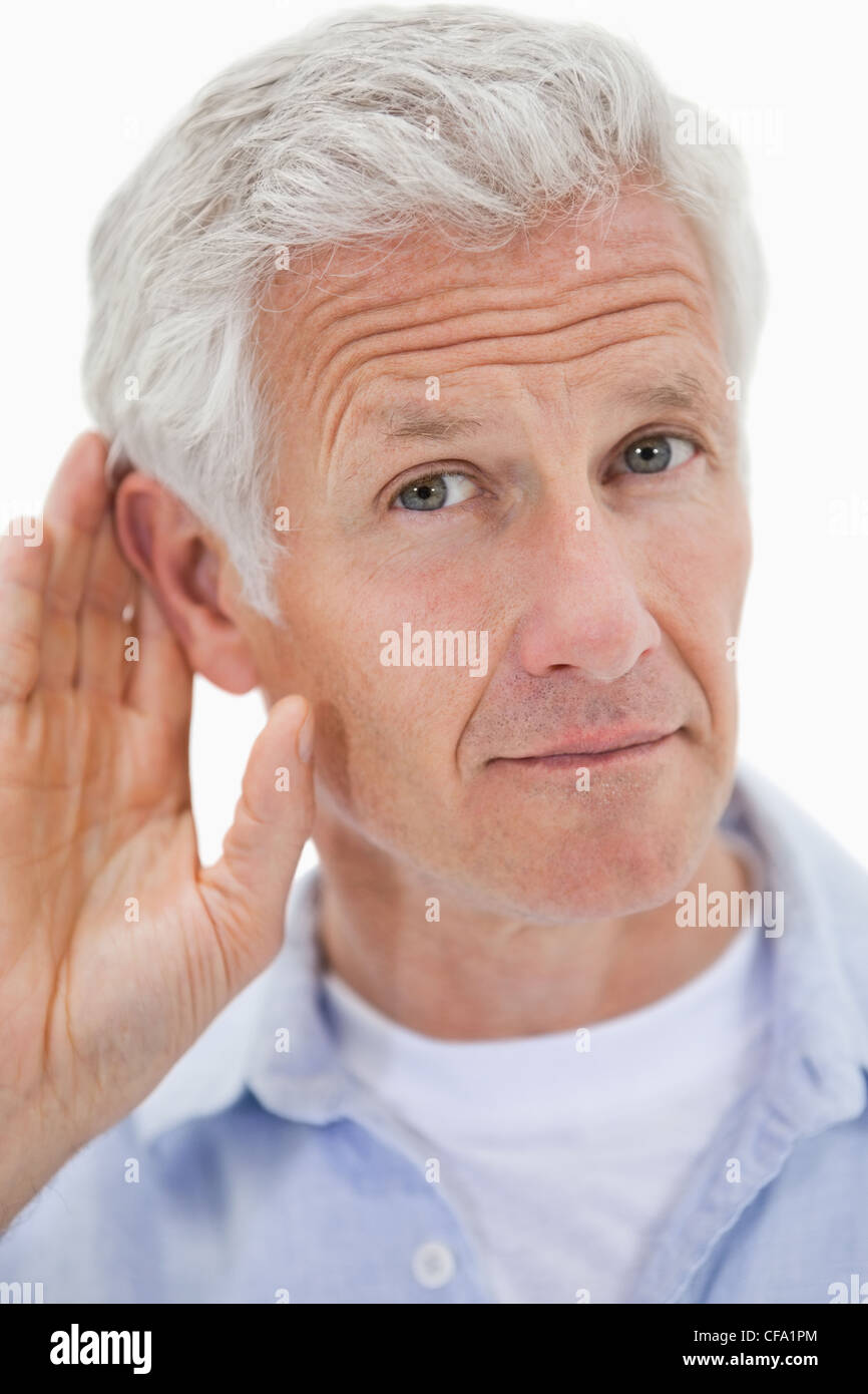 Portrait of a man giving his ear Stock Photo - Alamy