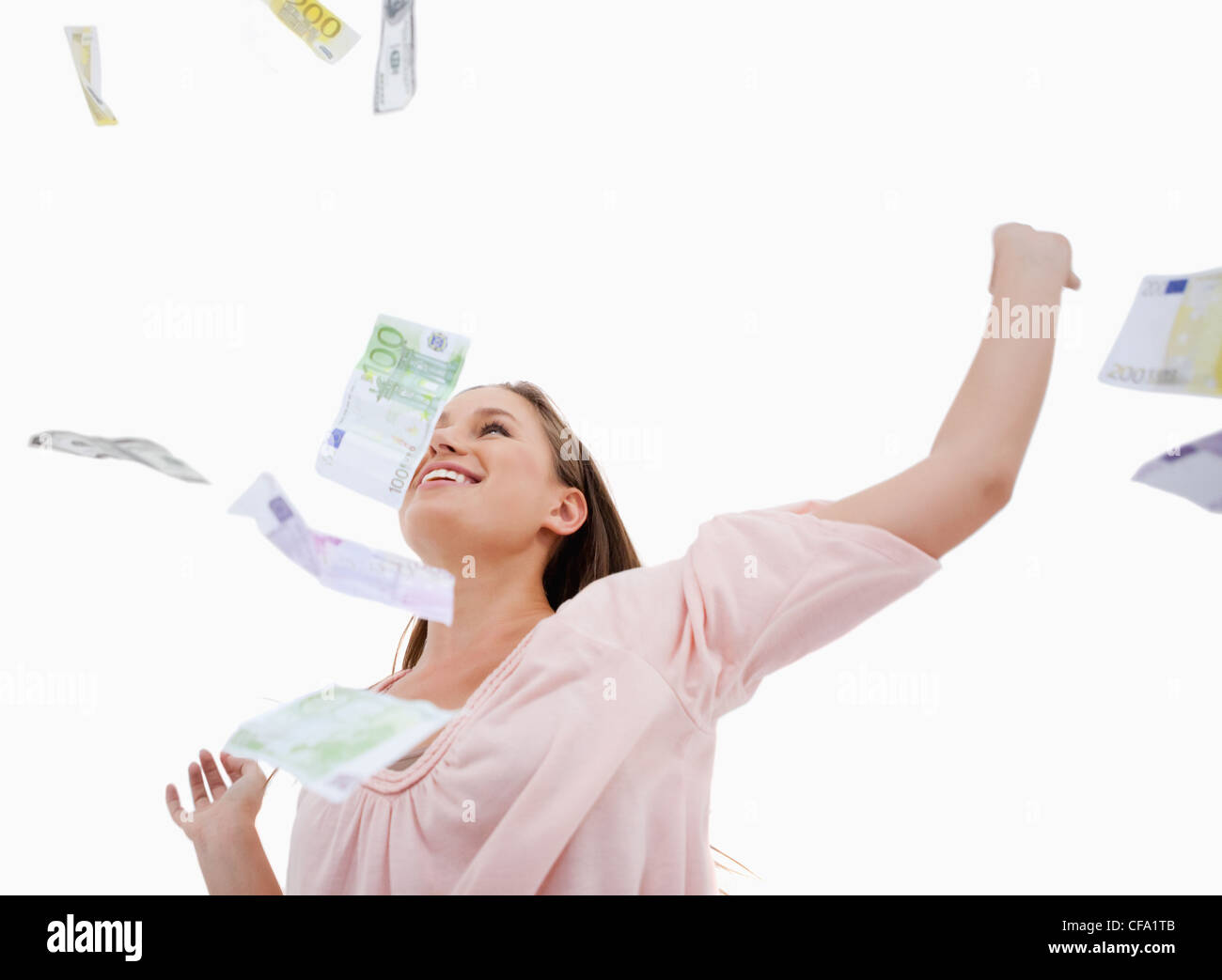 Woman and falling bank notes hi-res stock photography and images - Alamy