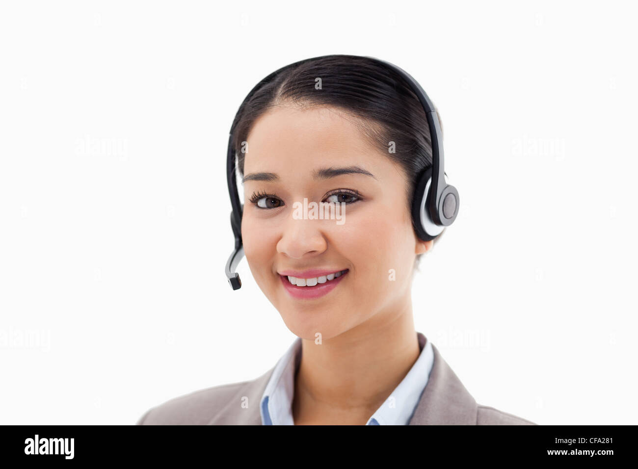 Smiling operator posing with a headset Stock Photo - Alamy