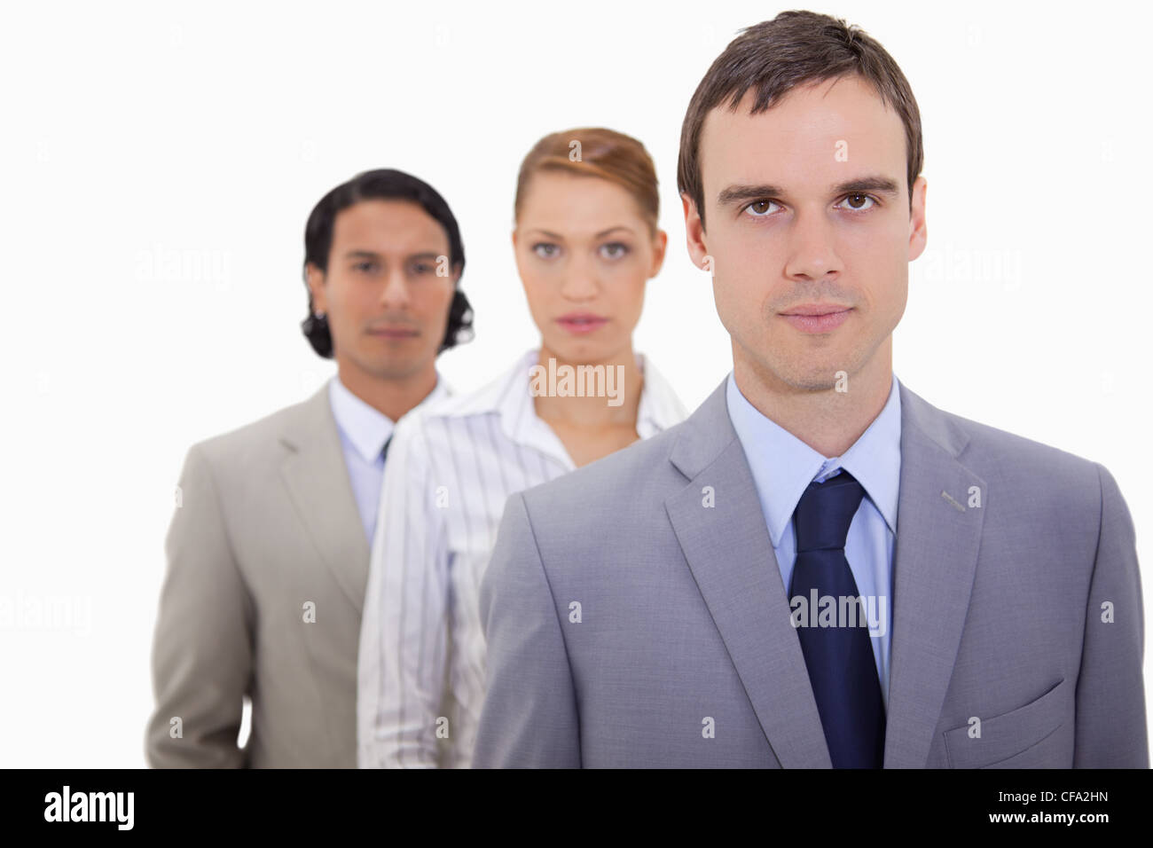 Serious Business team lined up Stock Photo - Alamy