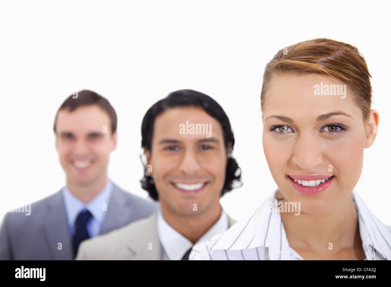 Smiling Business team standing in line Stock Photo - Alamy