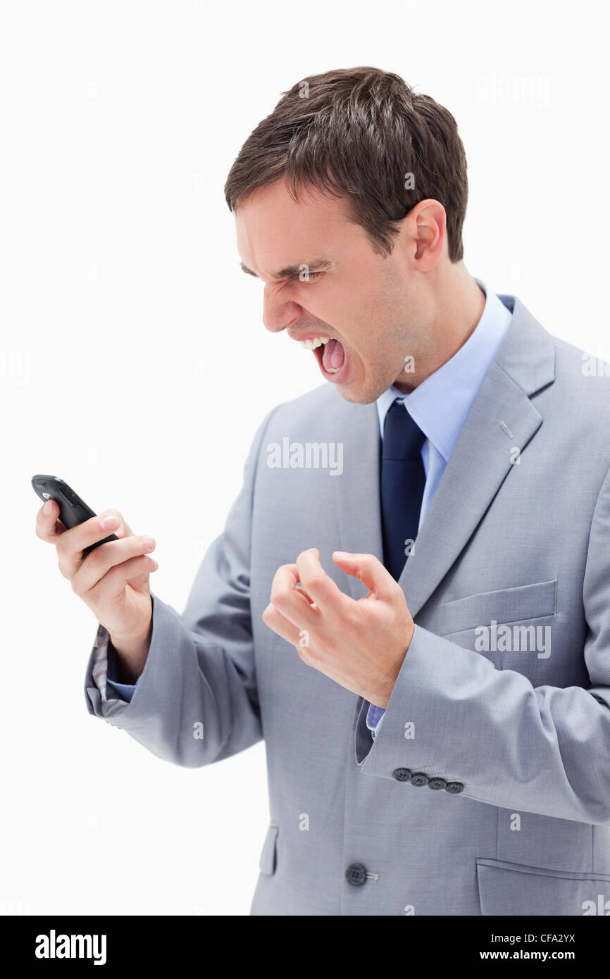 Angry businessman yelling at his cellphone Stock Photo - Alamy