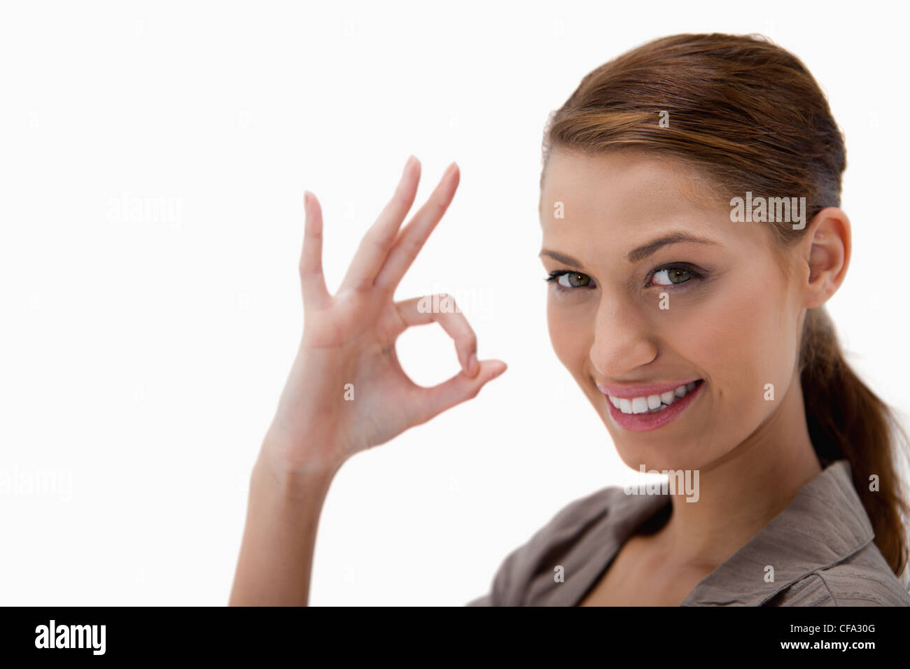 Side view of woman giving approval Stock Photo - Alamy