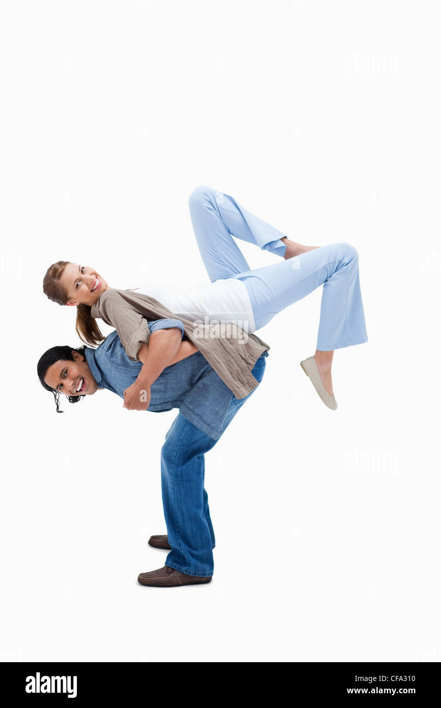 Man lifting his girlfriend on his back Stock Photo - Alamy