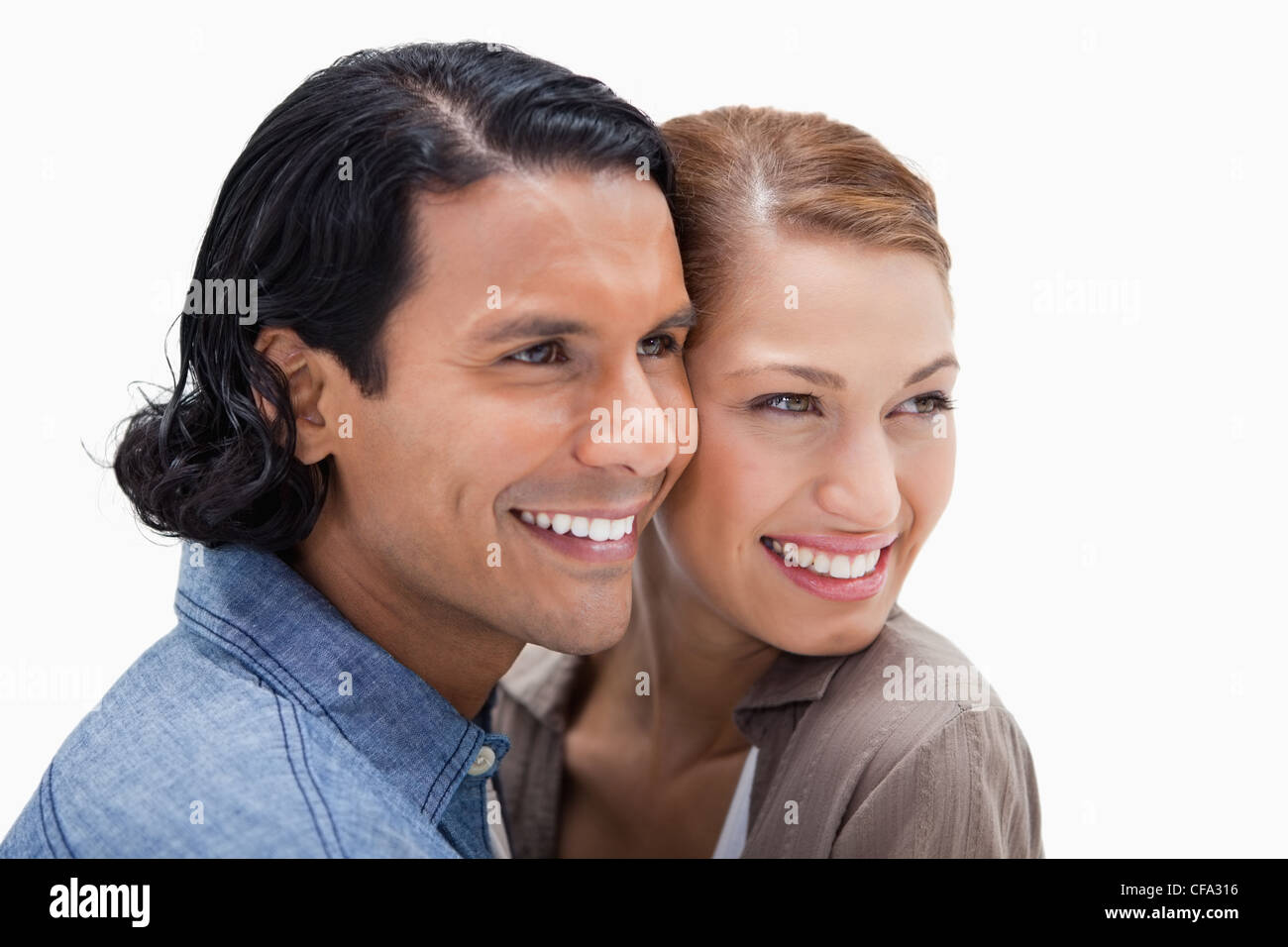 Side view of close together standing couple Stock Photo - Alamy