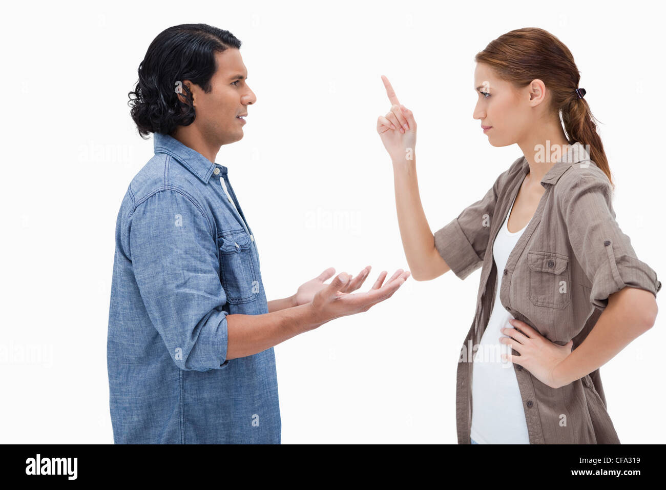 Side view of couple in a tensed conversation Stock Photo - Alamy