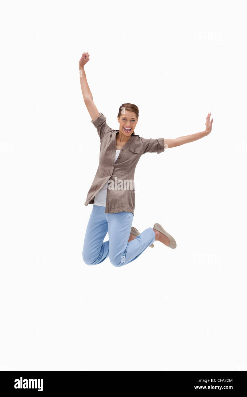 Cheerful woman jumping Stock Photo - Alamy