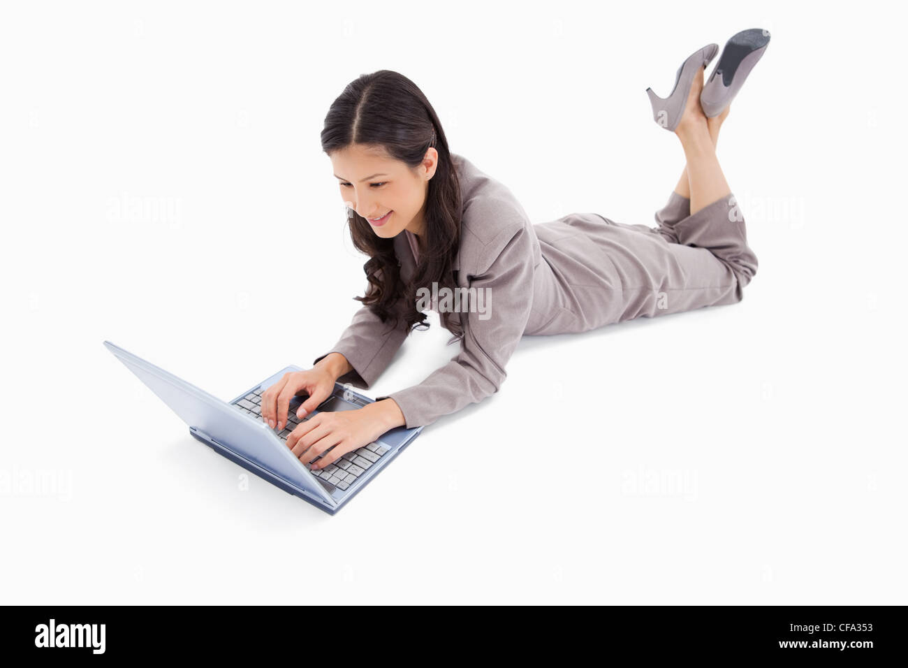 Business woman lying on floor Cut Out Stock Images & Pictures - Alamy