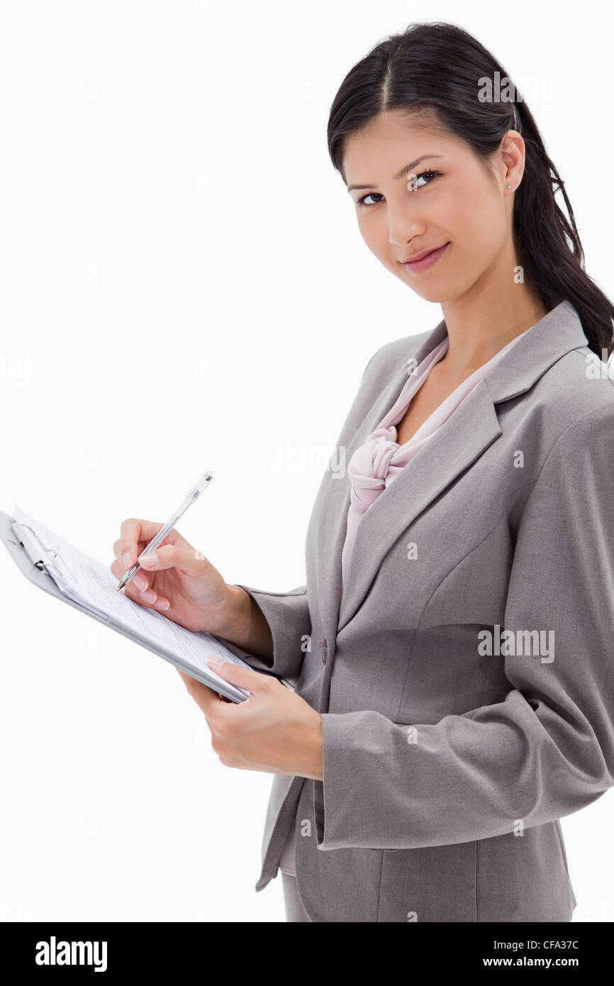 Side view of businesswoman taking notes Stock Photo - Alamy