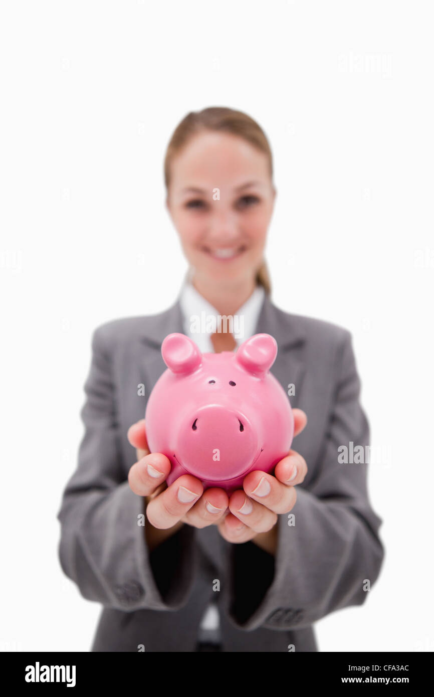Piggy bank being offered by smiling bank employee Stock Photo - Alamy