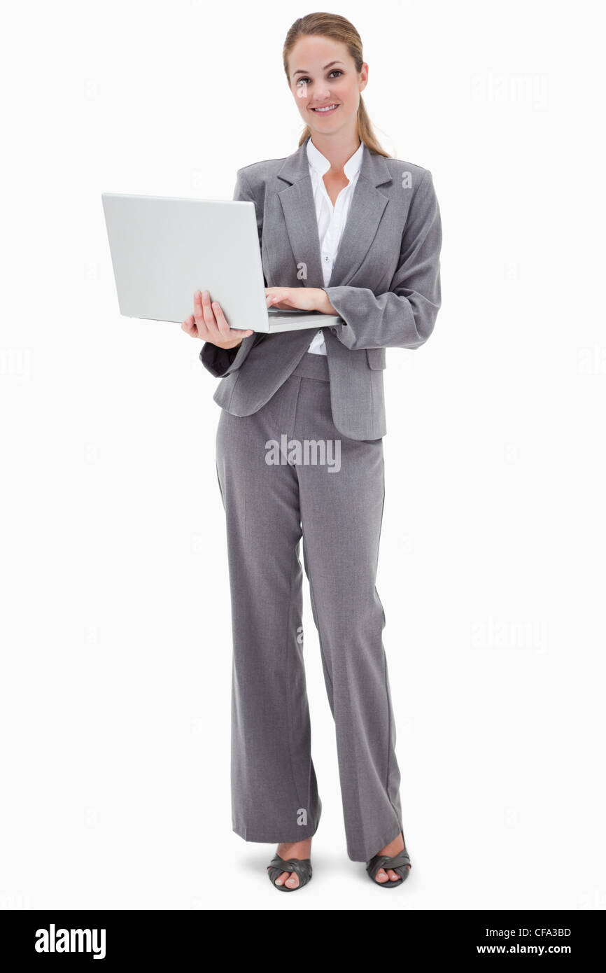 Smiling bank employee with laptop Stock Photo - Alamy