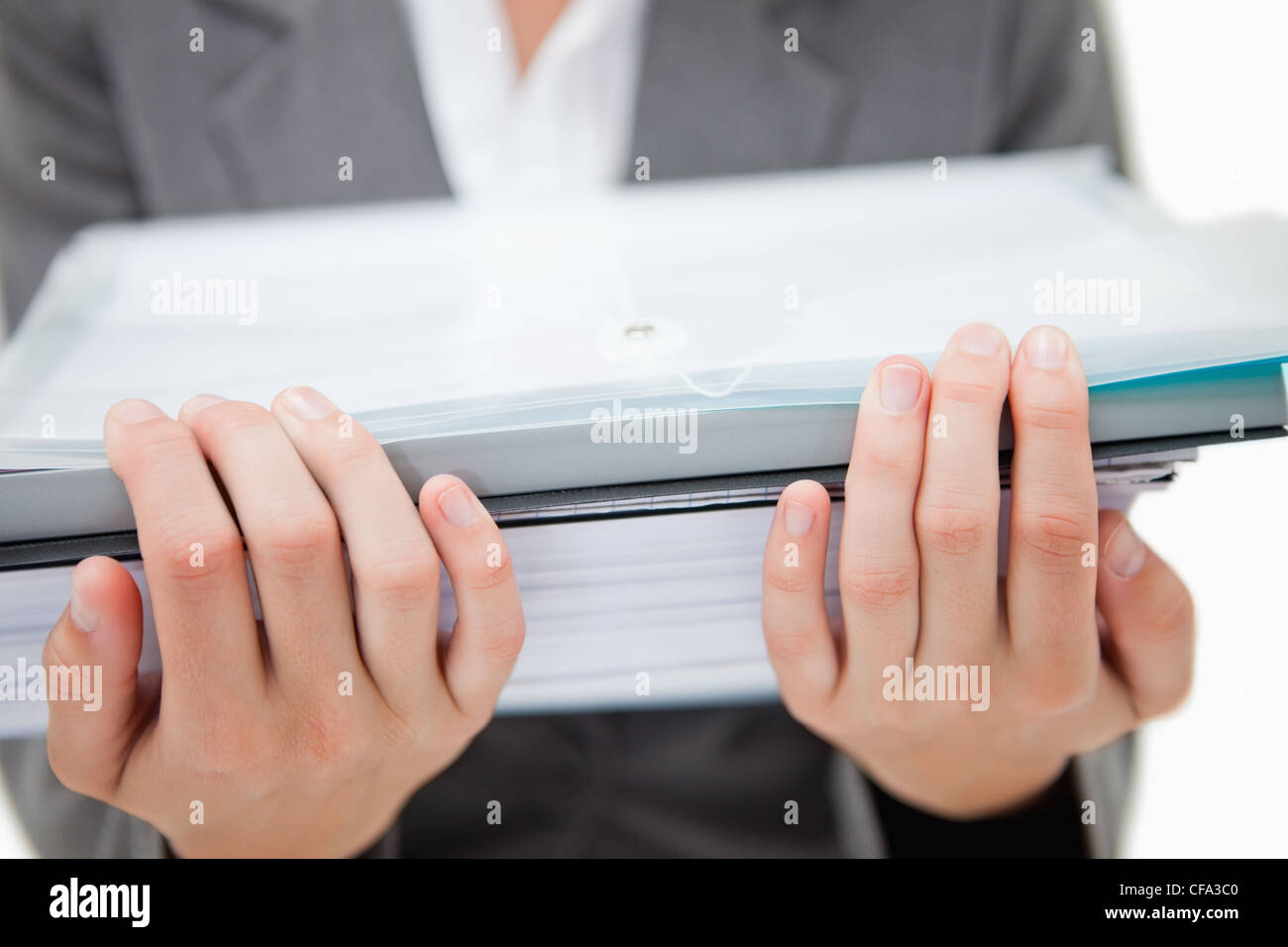 Pile of paperwork being held by female hands Stock Photo - Alamy