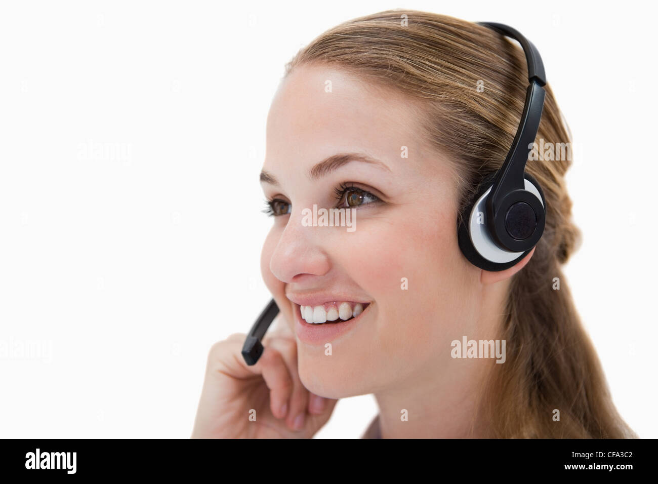 Side view of smiling call center agent Stock Photo - Alamy