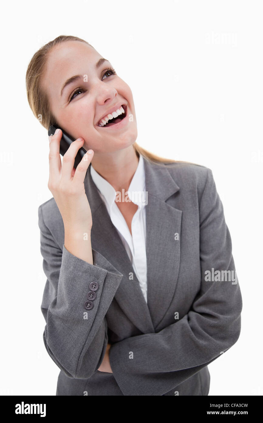 Laughing bank employee on her cellphone Stock Photo - Alamy