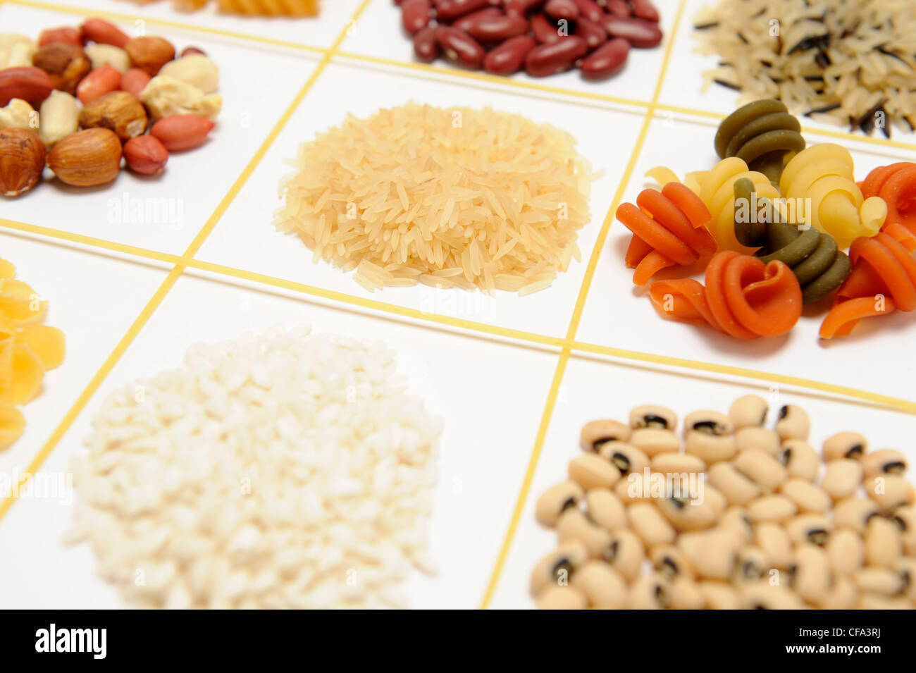 Small piles of different types of carbohydrates a white background ...