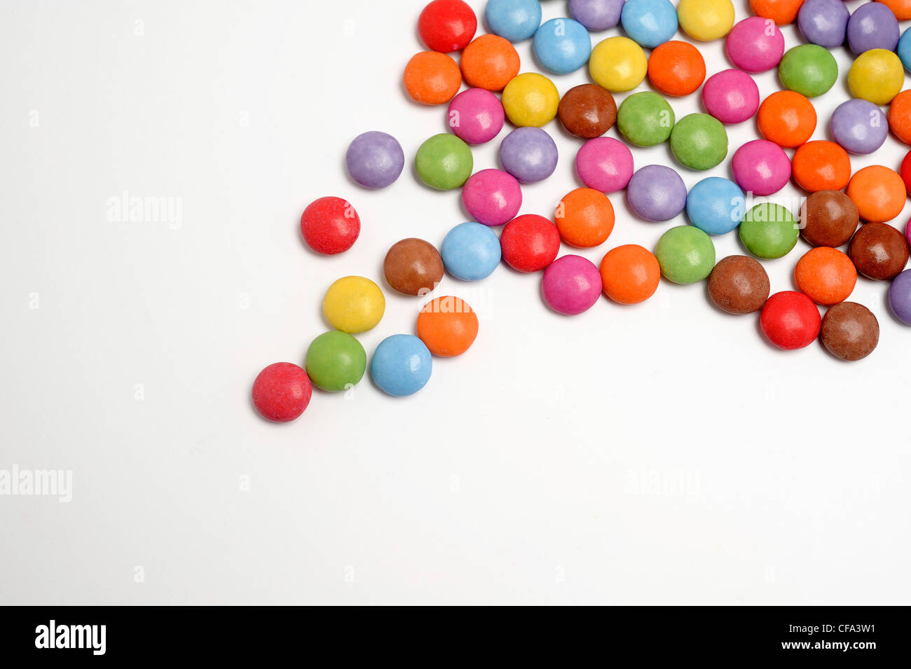 Multi coloured sugar coated chocolate Stock Photo - Alamy