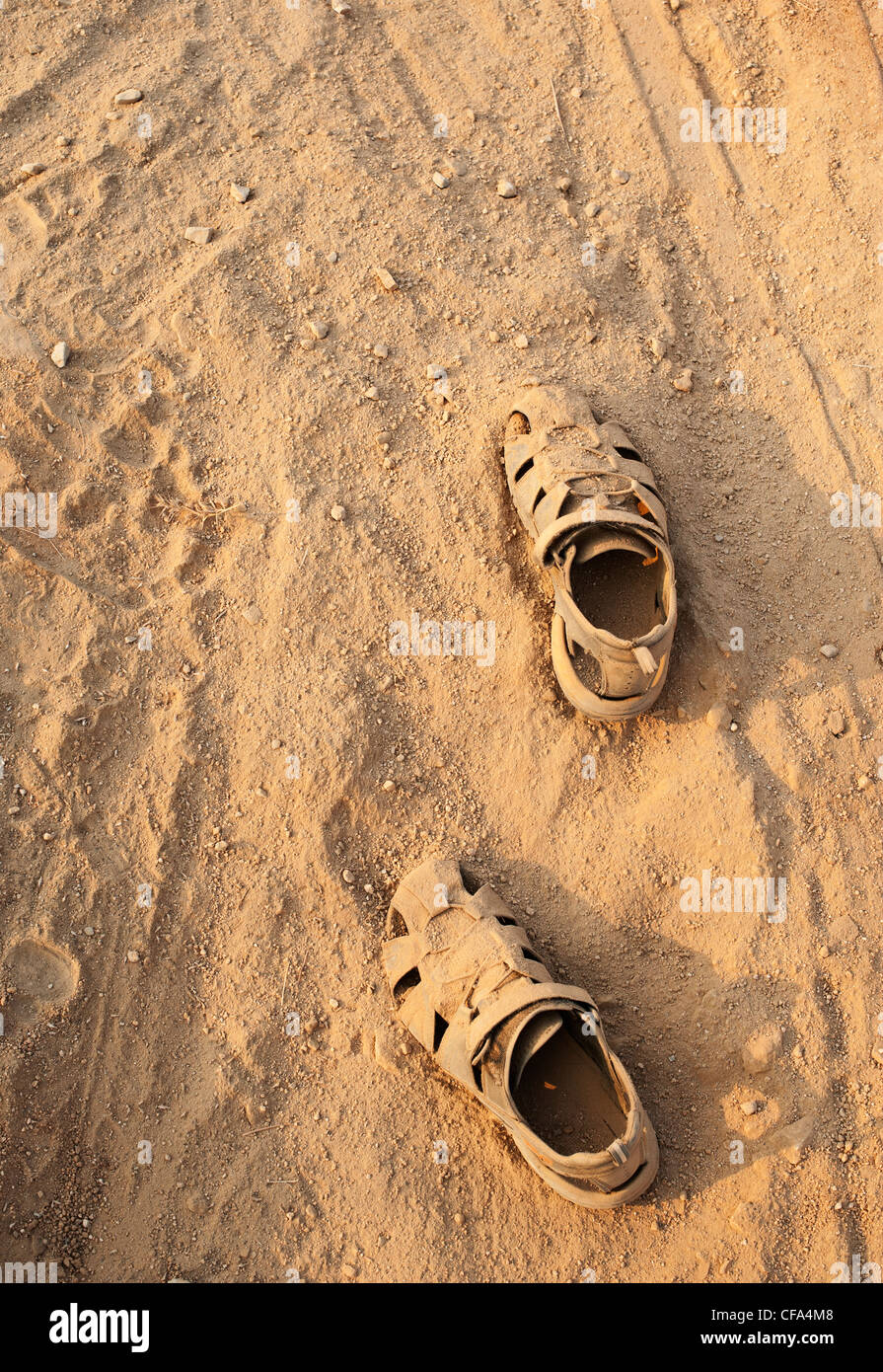 Worn out dirty dusty walking sandals Stock Photo - Alamy