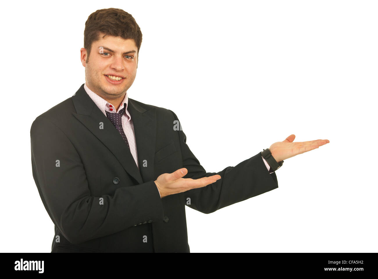 Smiling business man making presentation to right part of image isolate ...