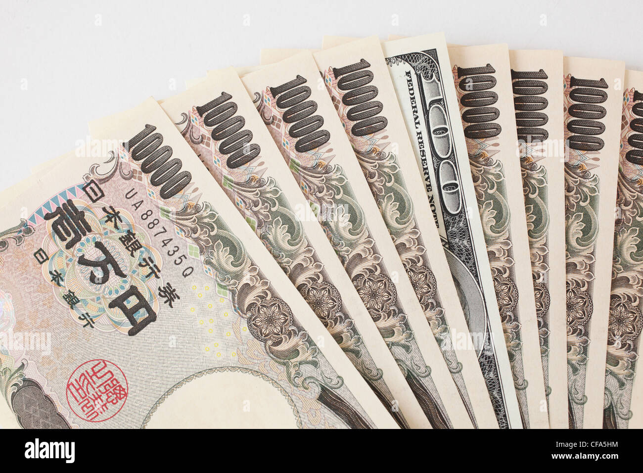 Japanease 10000 yen and 100 Dollar Stock Photo - Alamy
