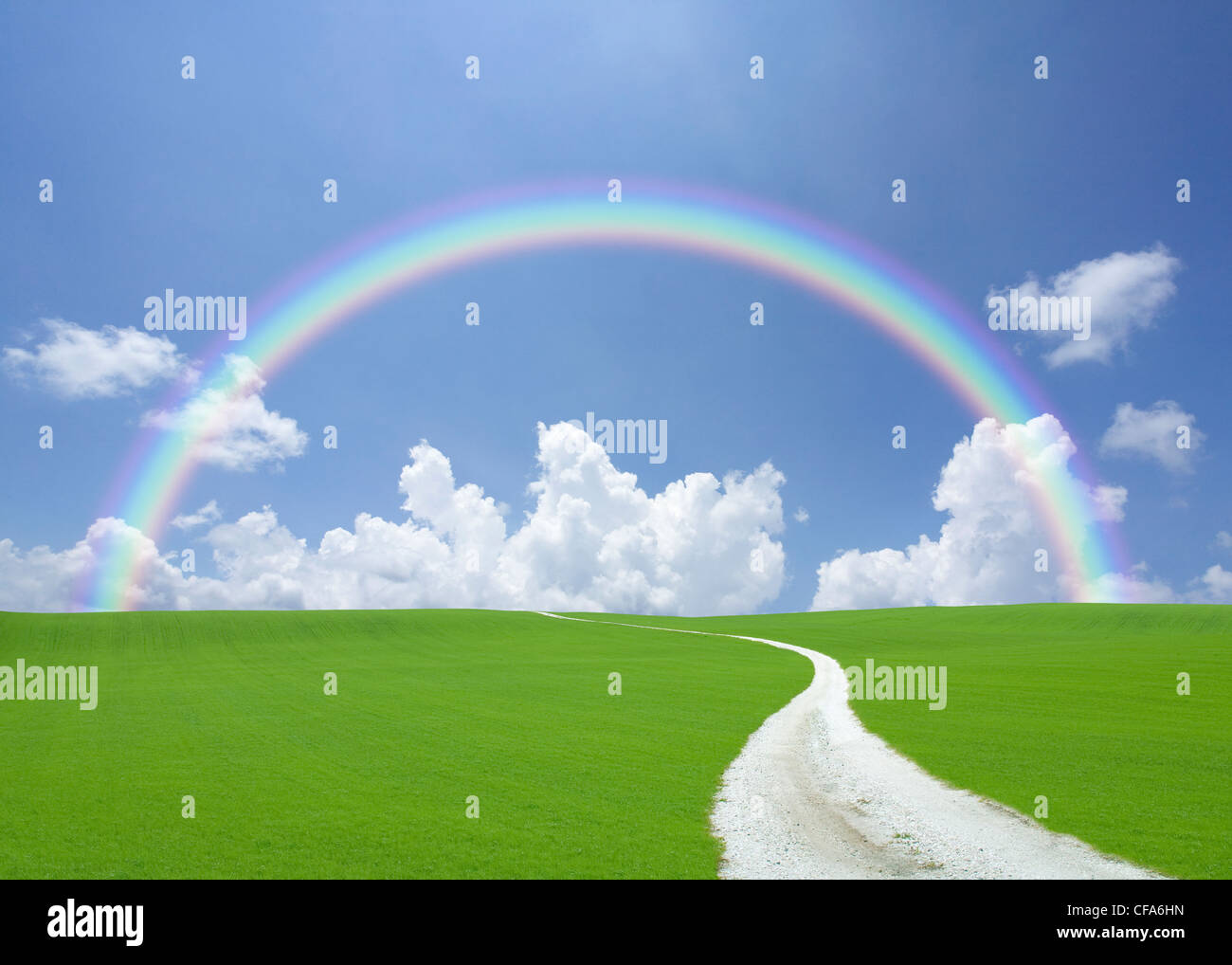 Green hill and white road with rainbow Stock Photo - Alamy
